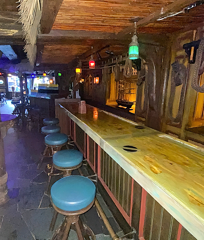 The Molokai Bar beckons with turquoise stools and colorful lanterns. It's where tiki dreams and rum realities happily collide.