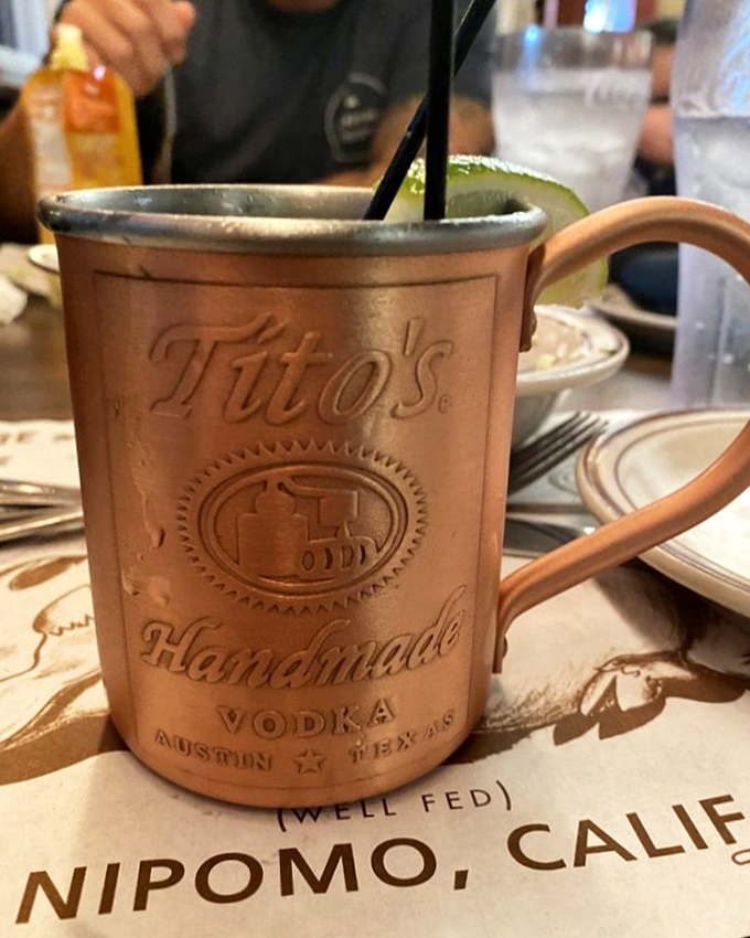 A Moscow Mule that means business, served in a copper mug that's seen things. Those cherries aren't garnish&mdash;they're the reward at the bottom of the glass.