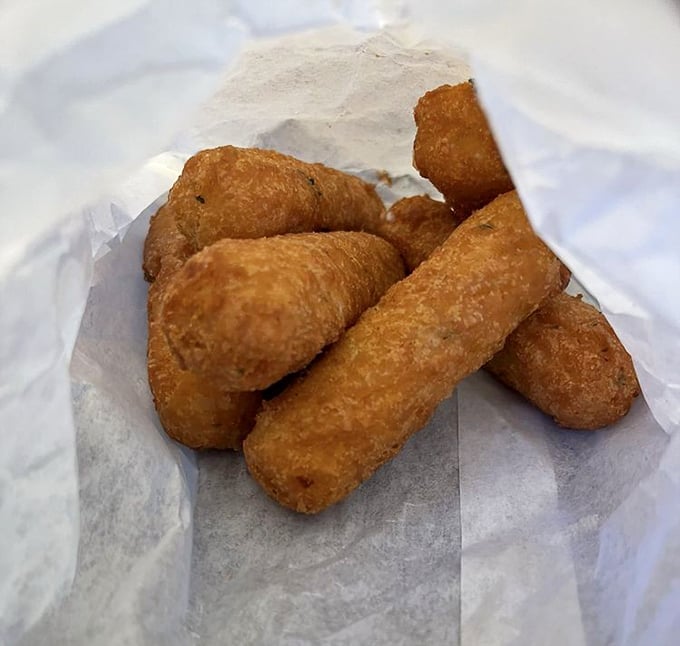 Golden-brown mozzarella sticks: the supporting actors that deserve their own spinoff show. Crispy exterior, molten cheese interior&mdash;pure comfort.
