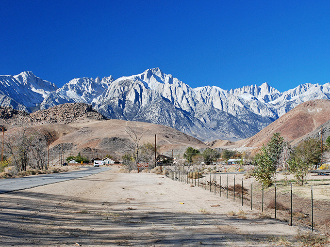Mount Whitney commands attention from every angle in Lone Pine, its jagged peaks reaching skyward like nature's own monument to geological ambition.