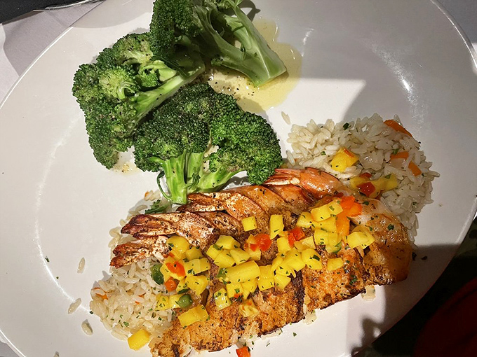 Grilled shrimp with mango salsa and rice &ndash; proof that not everything at a steakhouse needs to moo first to be memorable.