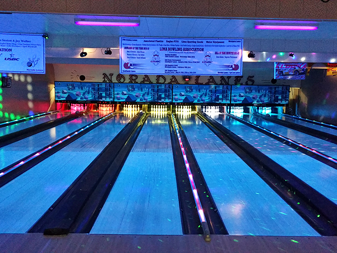 Norada Lanes glows with neon promise—where perfect games are rare but perfect evenings with friends are guaranteed.