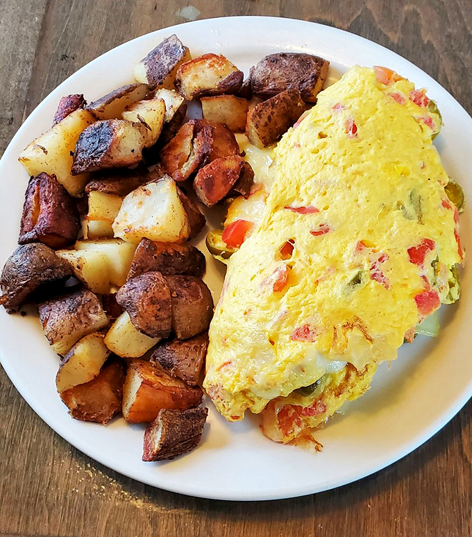 Behold the omelet that dreams are made of&mdash;studded with colorful vegetables and paired with home fries that could make a potato farmer weep with pride.