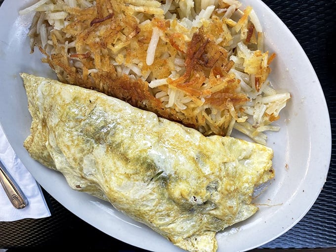 An omelet that defies physics&mdash;somehow both fluffy and substantial. Paired with hash browns crisped to golden perfection.
