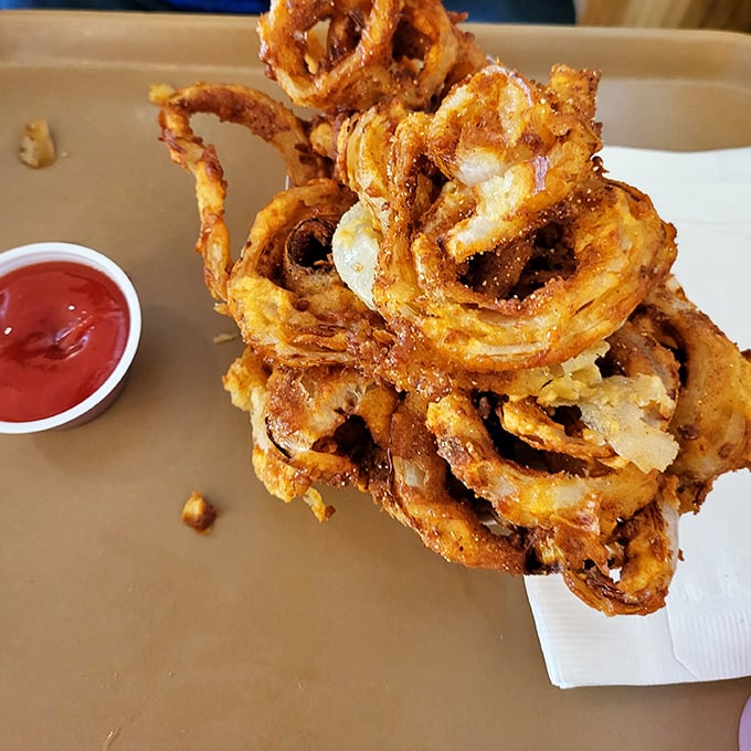 These aren't just onion rings &ndash; they're golden halos of perfectly fried goodness that make you question why you'd ever waste time on lesser sides.
