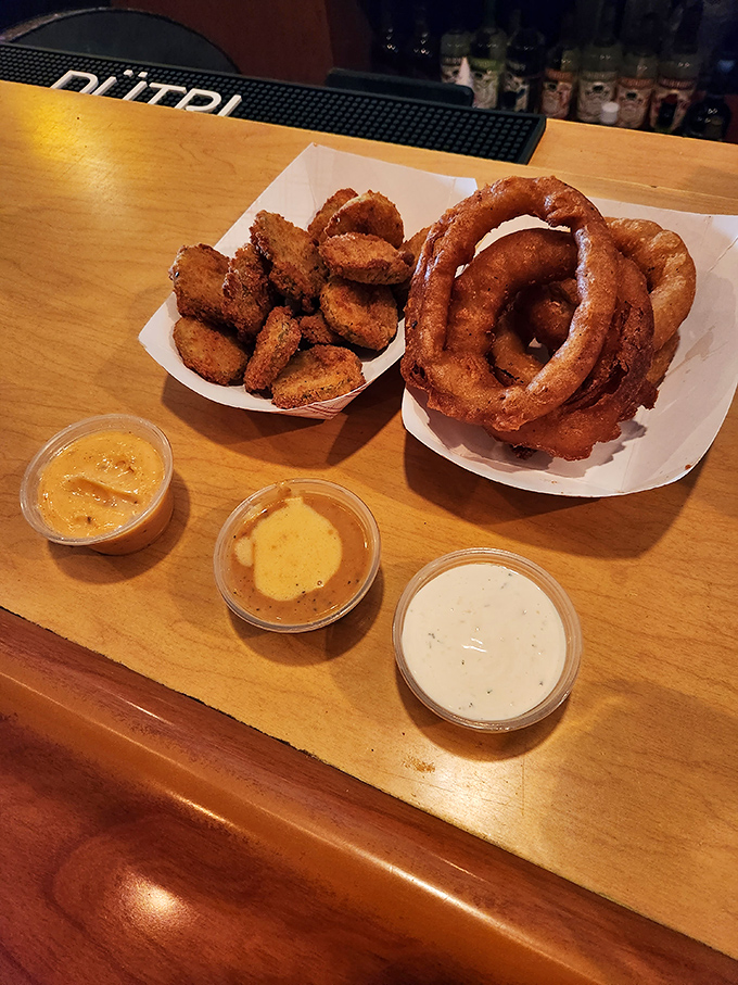 Onion rings and dipping sauces engaged in a perfect culinary tango. These golden hoops aren't just appetizers&mdash;they're edible jewelry for your taste buds. 