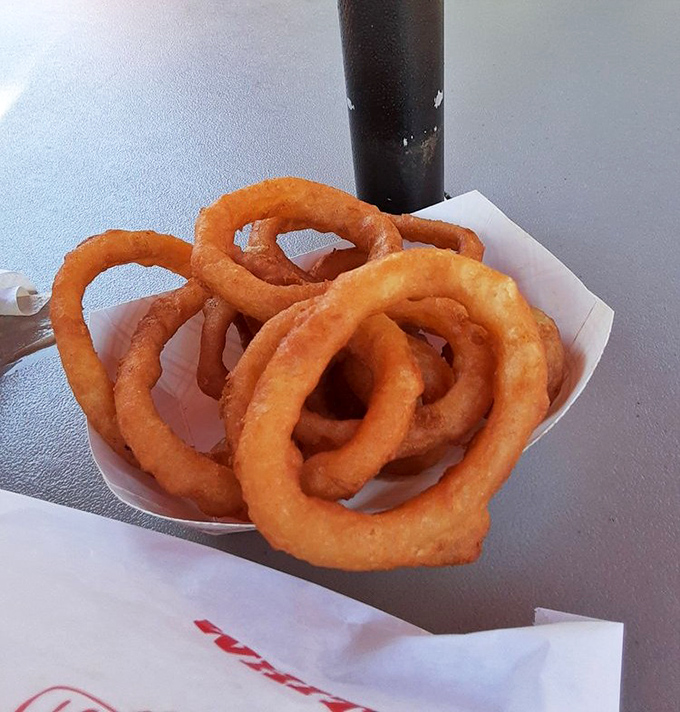 Onion rings with the structural integrity of Olympic gold. Crispy, never greasy, these golden halos deserve their own midwestern monument.