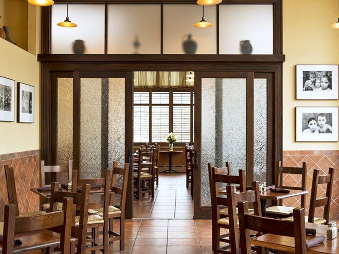 The thoughtful division of dining spaces creates intimate nooks without sacrificing the communal energy that makes Italian dining special.