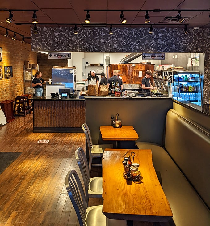 The dining room's warm wood and brick create that rare atmosphere where both first dates and family dinners feel equally at home.