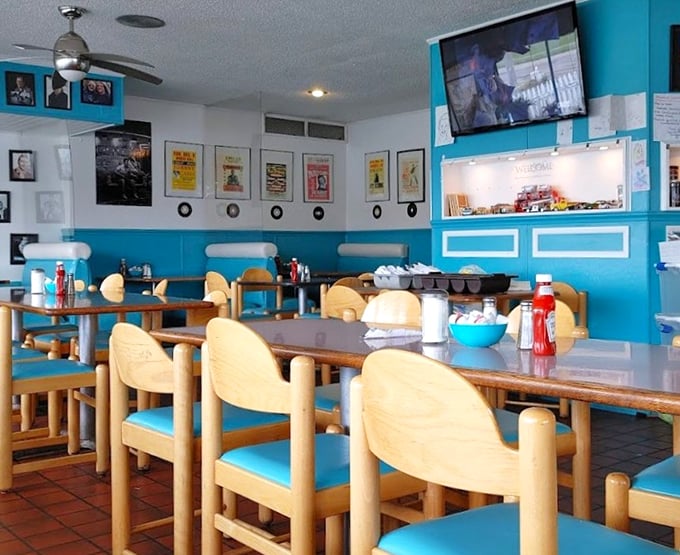 Wooden chairs, vintage posters, and turquoise accents&mdash;this isn't interior design, it's a love letter to the golden age of roadside dining.