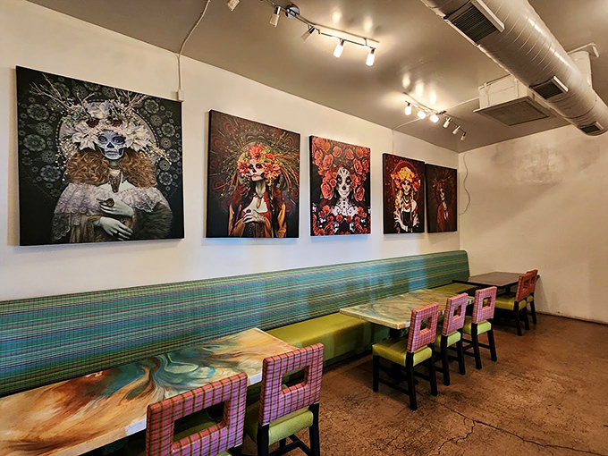 Day of the Dead artwork watches over diners like culinary guardian angels. The colorful bench seating practically demands you stay for "just one more taco."