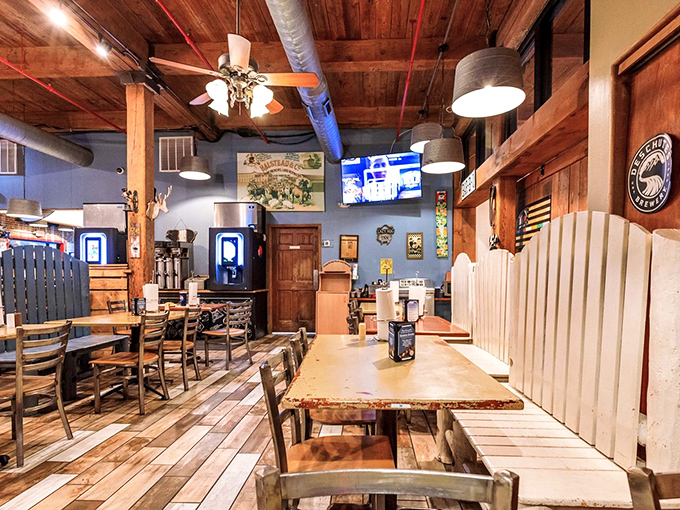 Wooden beams, rustic tables, and blue walls create the perfect backdrop for the serious business of barbecue appreciation.