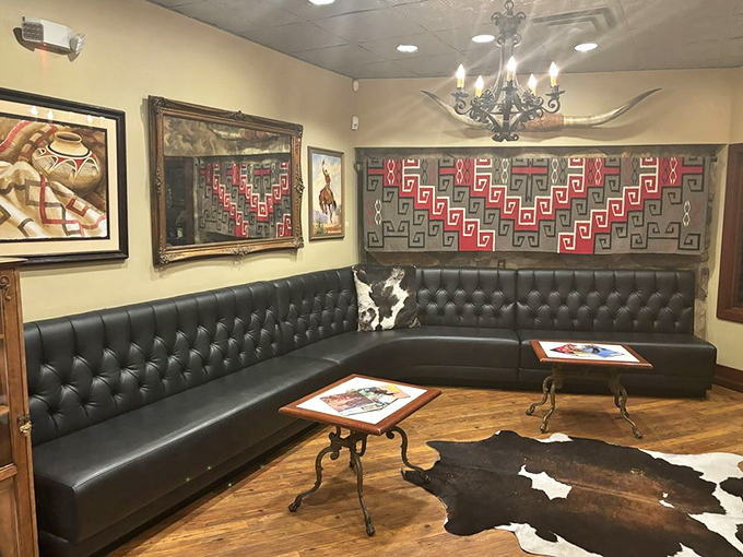 Leather banquettes, Southwestern art, and cowhide accents create a lounge area that feels both luxurious and authentically Western.