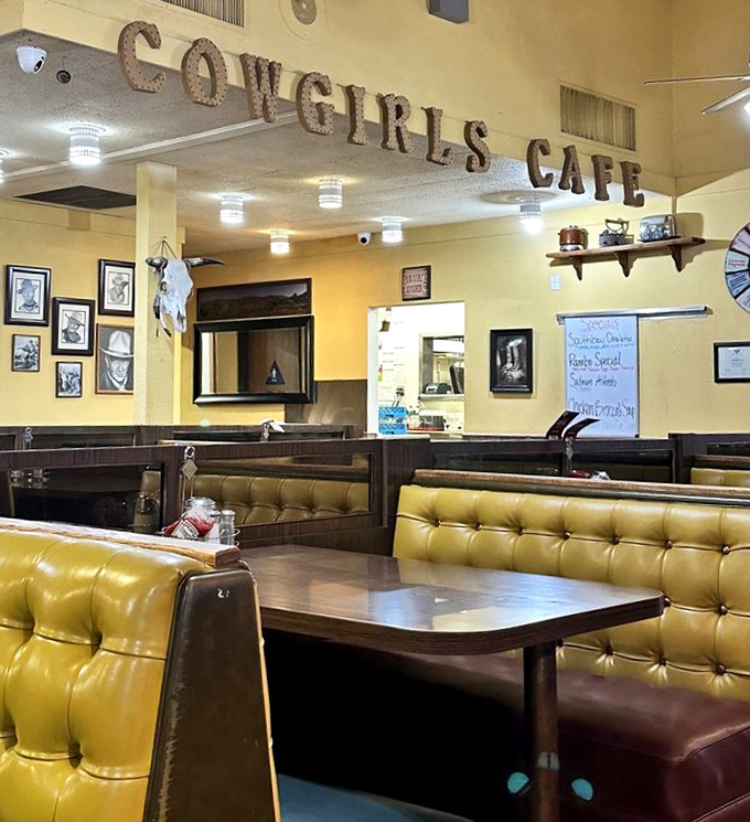 The iconic Cowgirls Cafe sign watches over its domain of tufted booths and ceiling fans. This is breakfast church, and we're all believers.