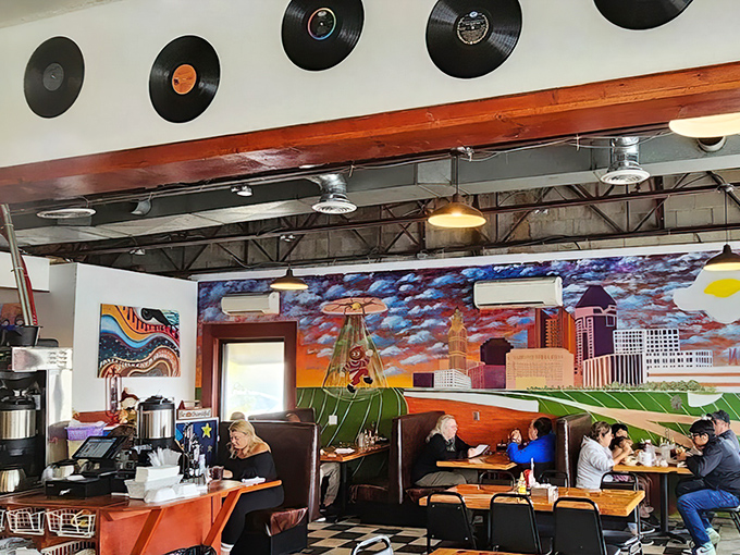 Columbus skyline art watches over diners like a colorful guardian. Those vinyl records on the wall aren't just decoration&mdash;they're the soundtrack to countless meals.