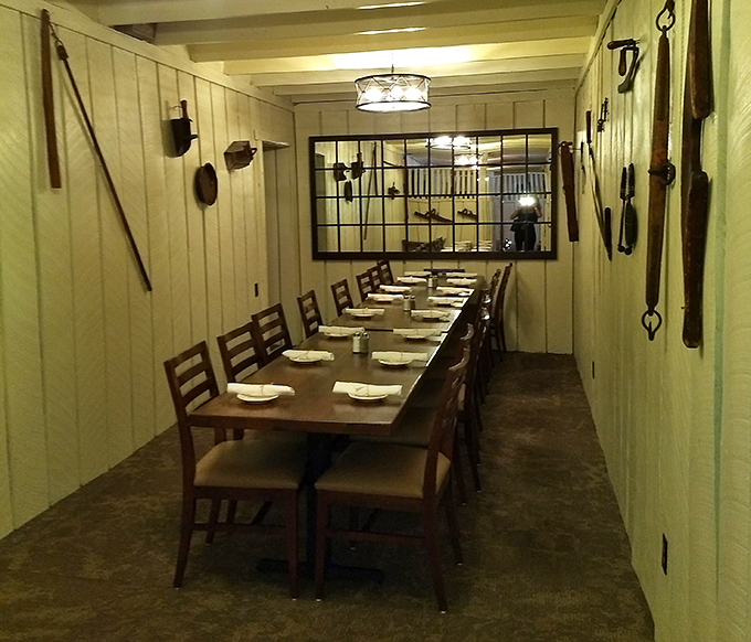 A private dining space where farm implements aren't decorative choices but respectful nods to the land that provides the evening's feast.