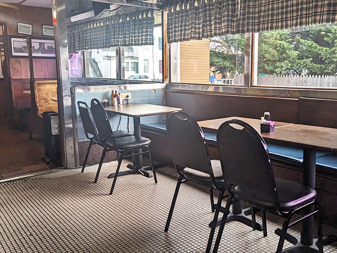 Booths designed for lingering conversations and second coffee refills, where the morning light creates the perfect backdrop for breakfast diplomacy.