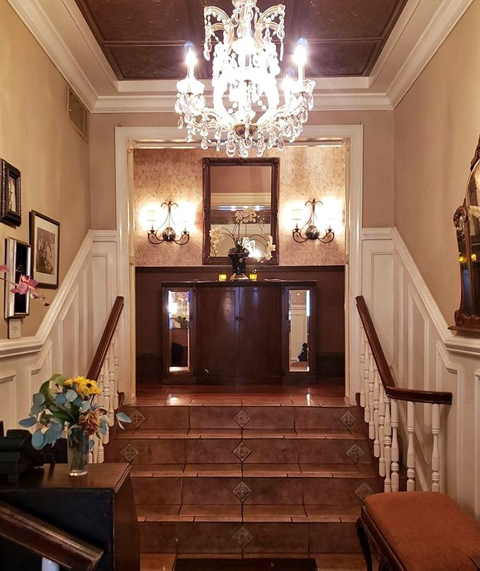 An entrance that sets the stage for the meal to come. That chandelier has probably witnessed more marriage proposals than a jewelry store.