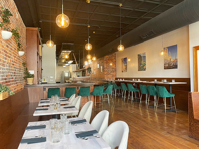 The perfect balance of rustic and refined, with teal bar chairs adding a pop of color that says, "Yes, Italians know design too."