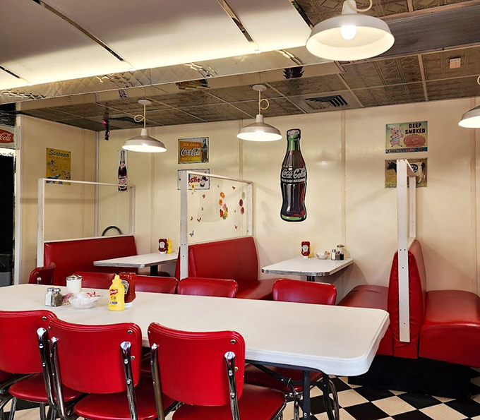 Red booths invite lingering conversations over endless coffee refills, while vintage Coca-Cola signs remind you that some pleasures remain deliciously unchanged by time.