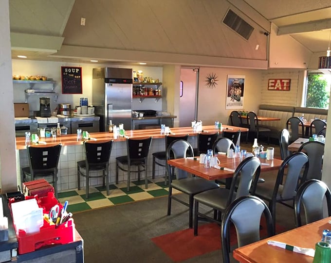 Counter seating where breakfast dreams come true, with an "EAT" sign that's less a suggestion and more a delightful command.