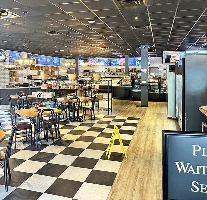 The dining room whispers "stay awhile" with its warm wood tones and checkered floor. This isn't just eating&mdash;it's an experience worth lingering over.