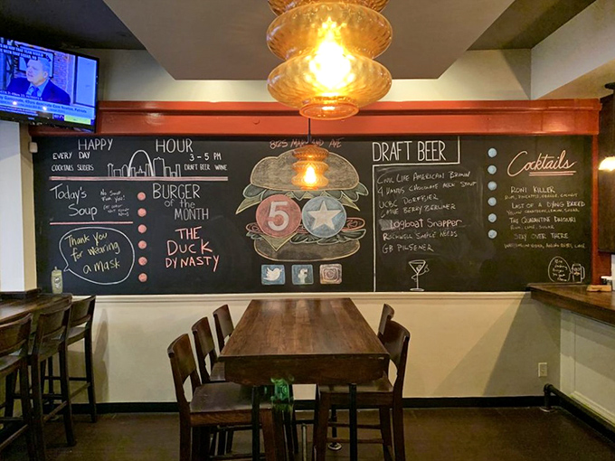 The chalkboard menu announces daily specials like breaking news. "Burger of the Month" deserves its own press conference.