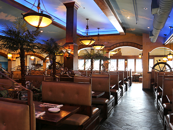 Leather booths, palm trees, and nautical wheels transform this Marietta restaurant into a coastal escape without the long drive to the shore.