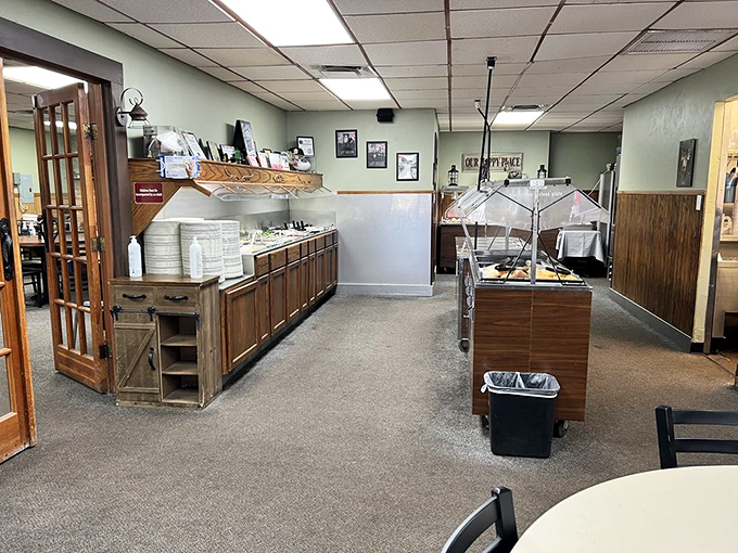 The buffet setup isn't fancy, but it's honest—like the food itself. Clean lines, wooden accents, and plenty of space for the parade of plates to come.