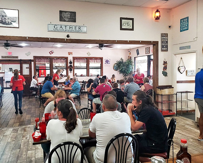 The "GATHER" sign says it all - this is where community happens over exceptional breakfast plates.