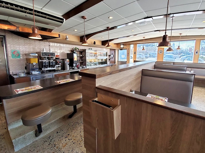 Modern booths with classic diner soul &ndash; where sliding in means sliding into a tradition of comfort that spans generations.