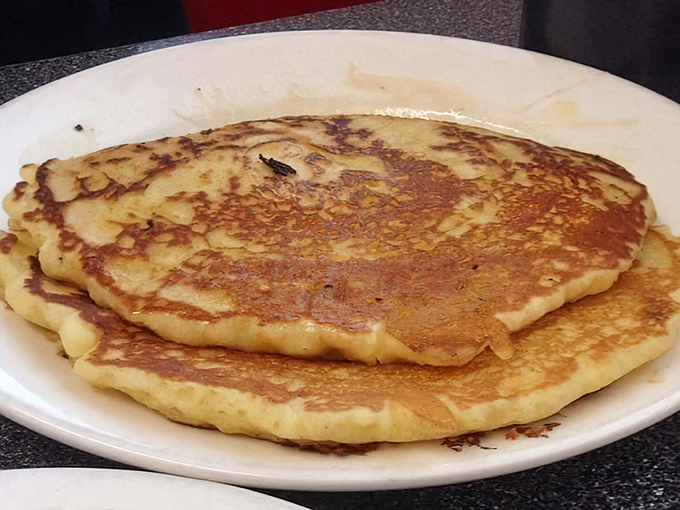Pancakes with the perfect golden-brown hue that makes you wonder if the griddle at Kuppy's possesses some kind of breakfast magic.