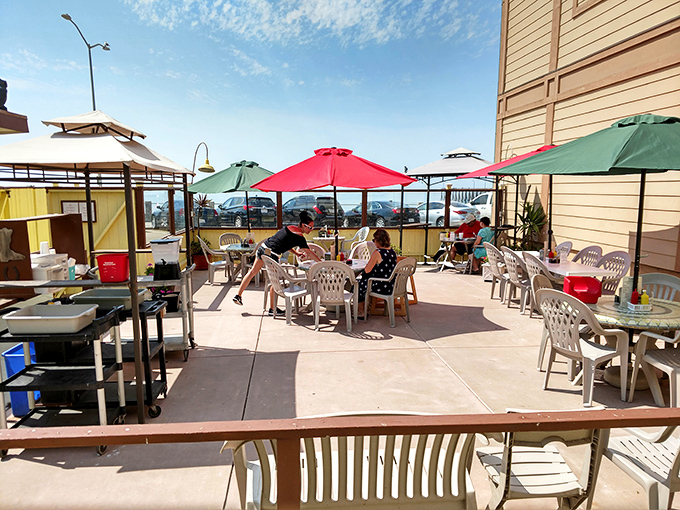 Al fresco dining with colorful umbrellas creating the perfect microclimate for enjoying seafood that was swimming this morning.