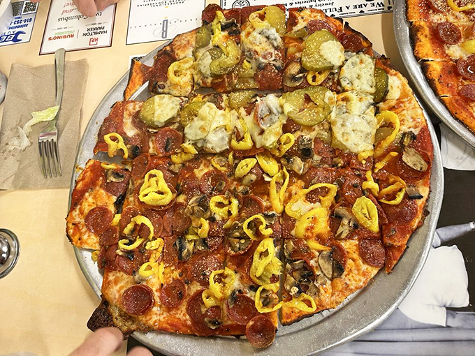 This pizza is wearing more toppings than I wear layers in an Ohio winter, and I'm here for every single one of them.