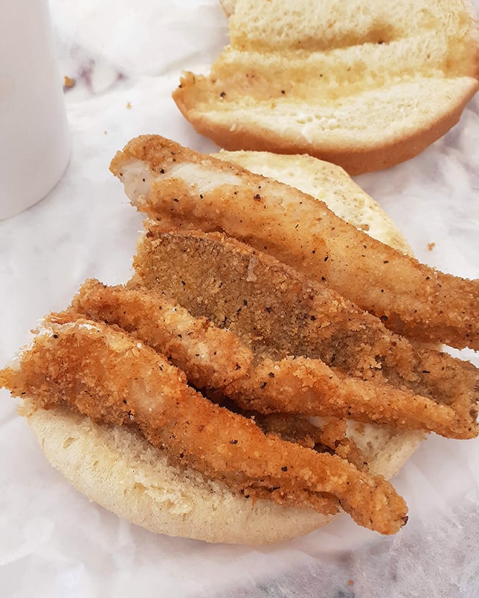 The perch sandwich: Lake Erie's finest contribution to lunch, wearing its golden-fried coat with well-deserved pride.