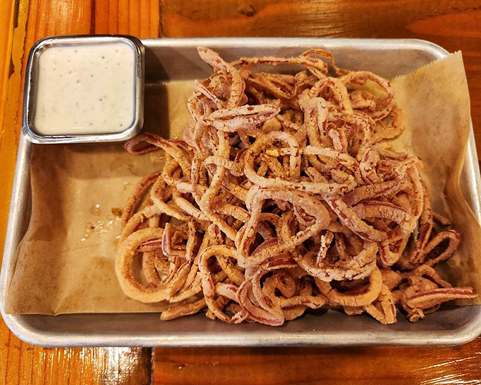 These aren't just onion strings&mdash;they're crispy, tangled evidence that vegetables can have more fun than the rest of the plate. 