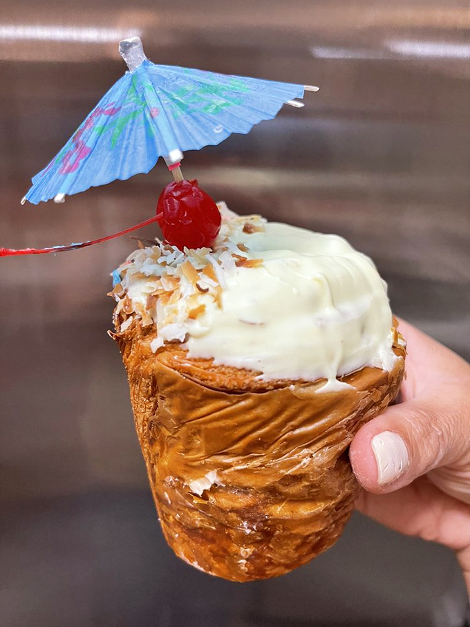 Vacation in pastry form. This pi&ntilde;a colada creation with its tiny umbrella isn't just cute&mdash;it's a tropical getaway for your taste buds.