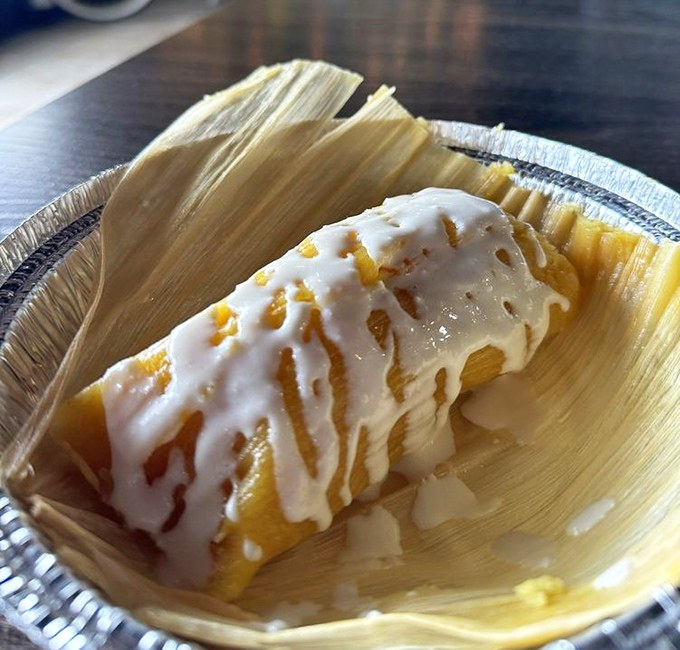 Sweet meets savory in this dessert tamale, where corn husk cradles a pineapple-infused treasure drizzled with delicate icing.