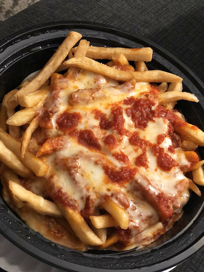 Pizza fries: the culinary equivalent of "why choose when you can have both?" Crispy fries smothered in sauce and melted cheese.