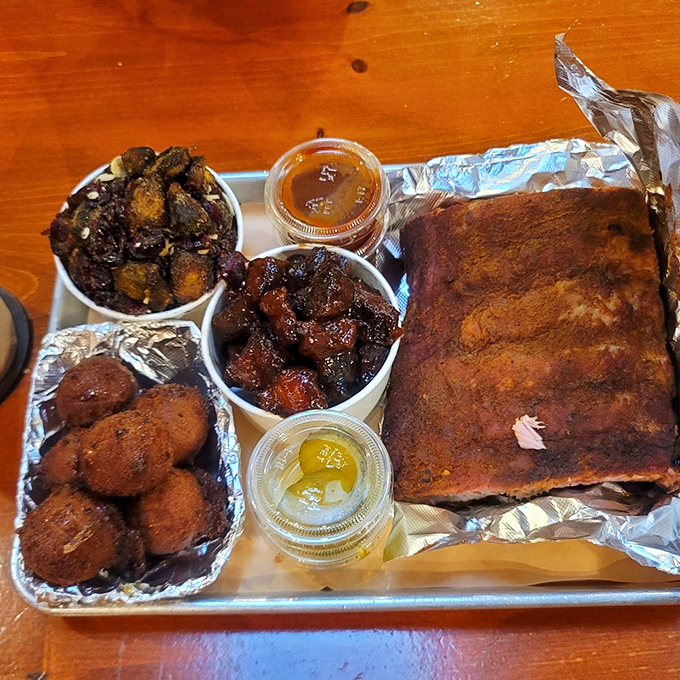 BBQ platter perfection: where hush puppies, burnt ends, and ribs gather for a family reunion on your tray. No utensils required, just napkins.
