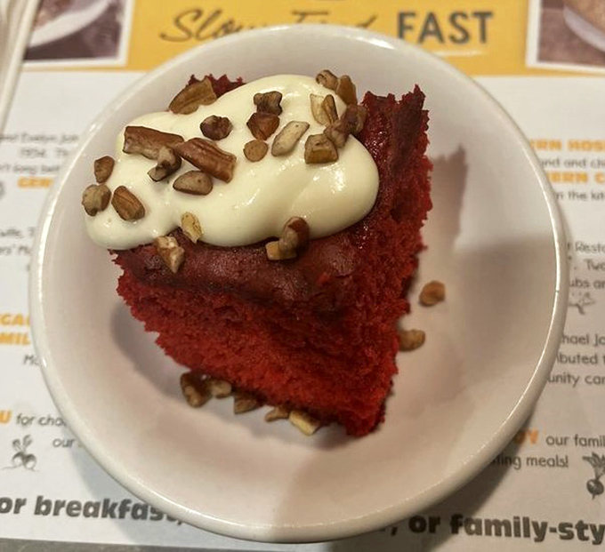 Red velvet cake topped with cream cheese frosting and pecans&mdash;proof that Fred's understands dessert isn't just the end of a meal, but a grand finale.