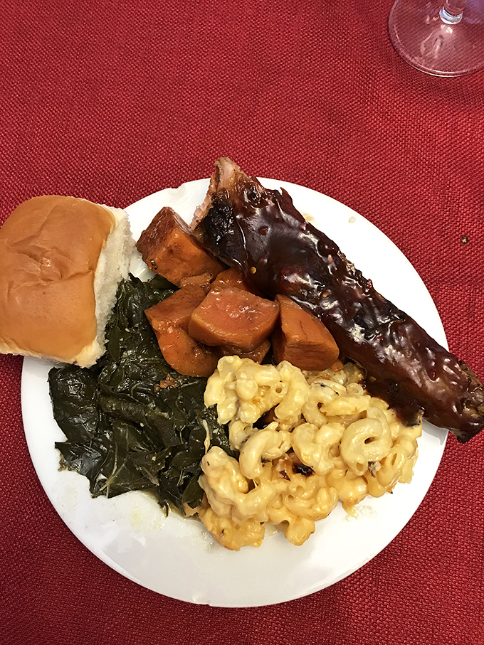 A plate that hits all the right notes: smoky ribs with sauce that means business, mac and cheese that's unapologetically indulgent, and greens that keep it real.