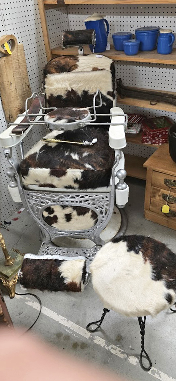 A barber chair that's seen more hairstyle trends than Vogue magazine, now reupholstered in cowhide for your rustic man-cave aspirations.