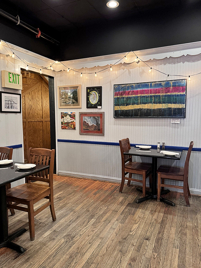 Cozy dining nooks adorned with local artwork create intimate spaces perfect for lingering conversations.