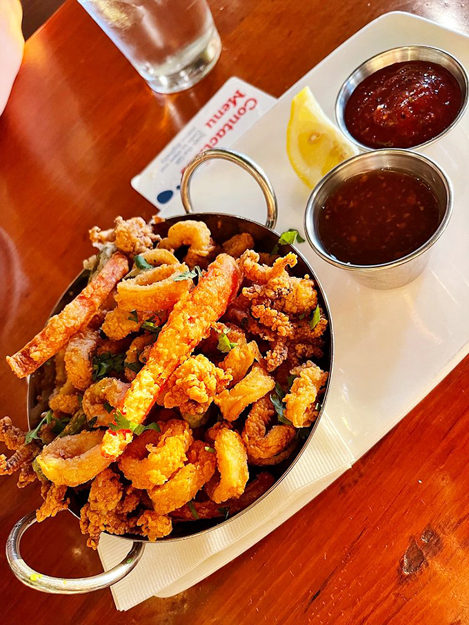 Calamari so perfectly fried it makes you forget you're eating something with tentacles. Those dipping sauces aren't optional&mdash;they're your ticket to flavor paradise.