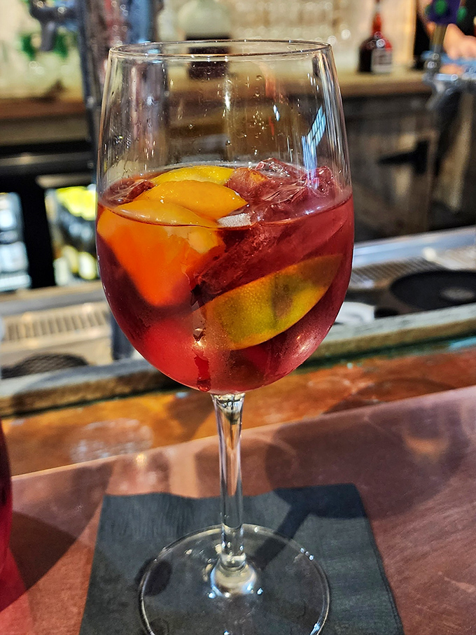 This sangria isn't just a drink; it's a sunset in a glass, with fruit playing the role of delicious floating islands.