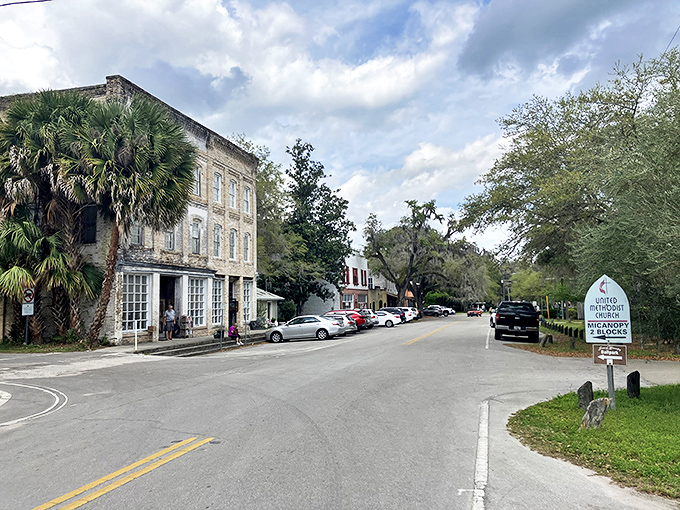 Seminary Street curves gently past buildings that have watched generations come and go, their weathered facades telling stories without saying a word.
