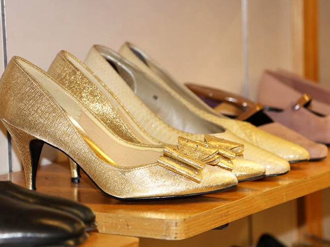 Golden heels lined up like trophies of shopping victories past. Someone's special occasion footwear awaiting its next dance floor.