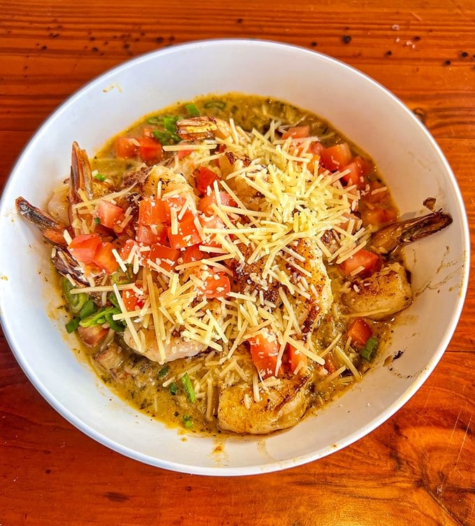 Shrimp and grits that would make a Southerner weep with joy &ndash; creamy, cheesy, and topped with enough shrimp to make you feel downright spoiled.