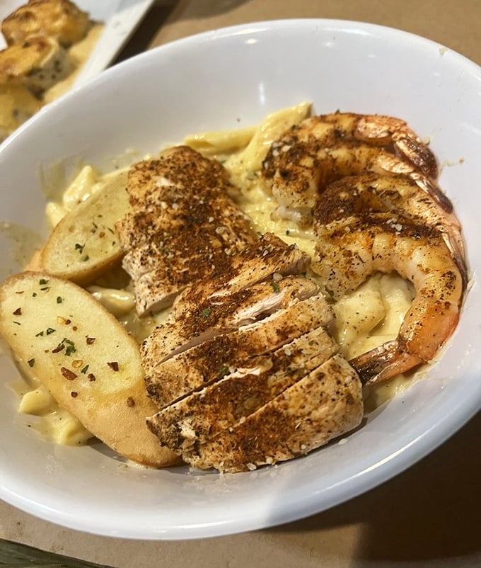 Pasta that looks like it dressed up for dinner, with shrimp and chicken playing perfectly together.